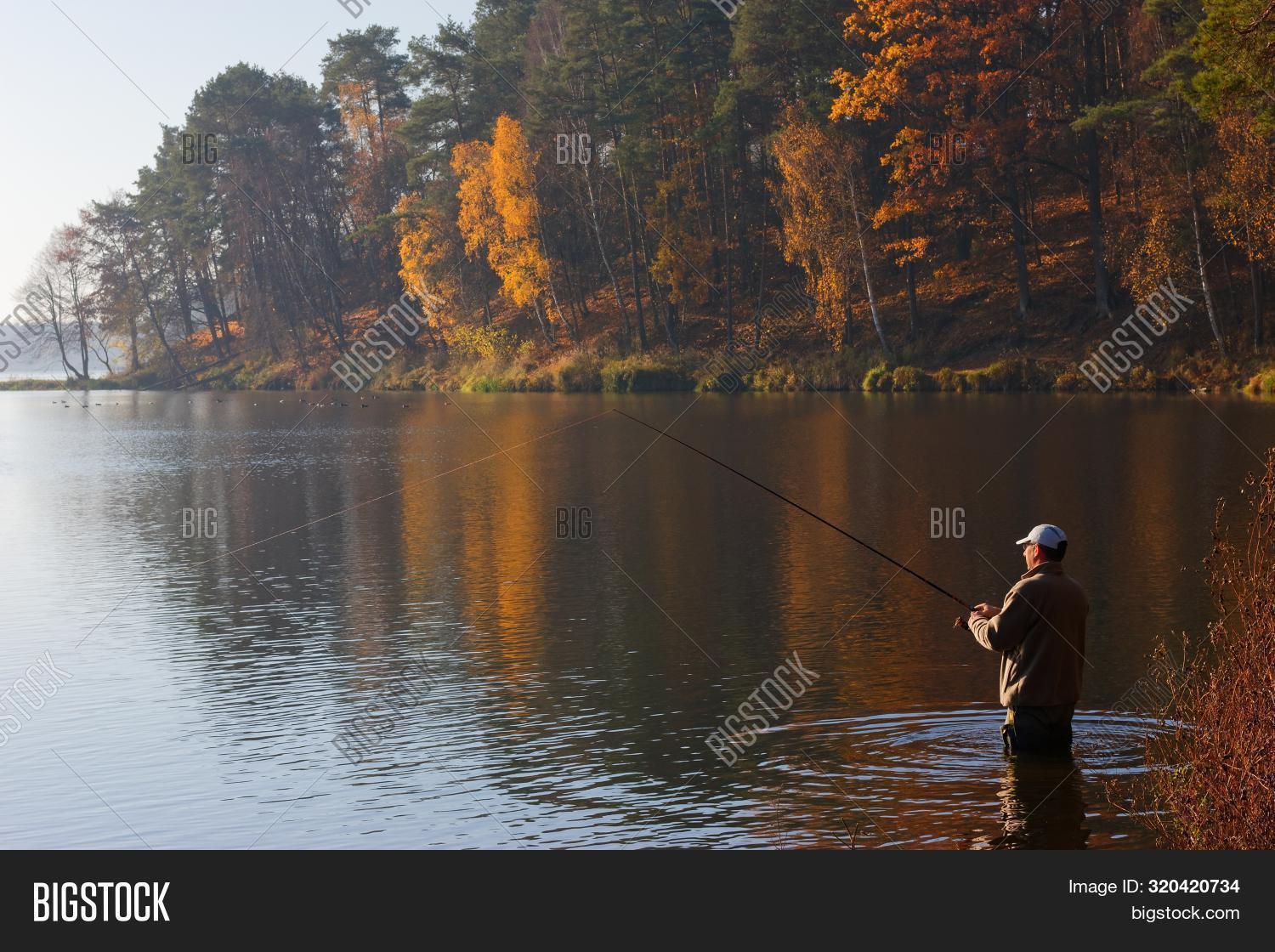 Angler Catching Fish Image & Photo (Free Trial) | Bigstock
