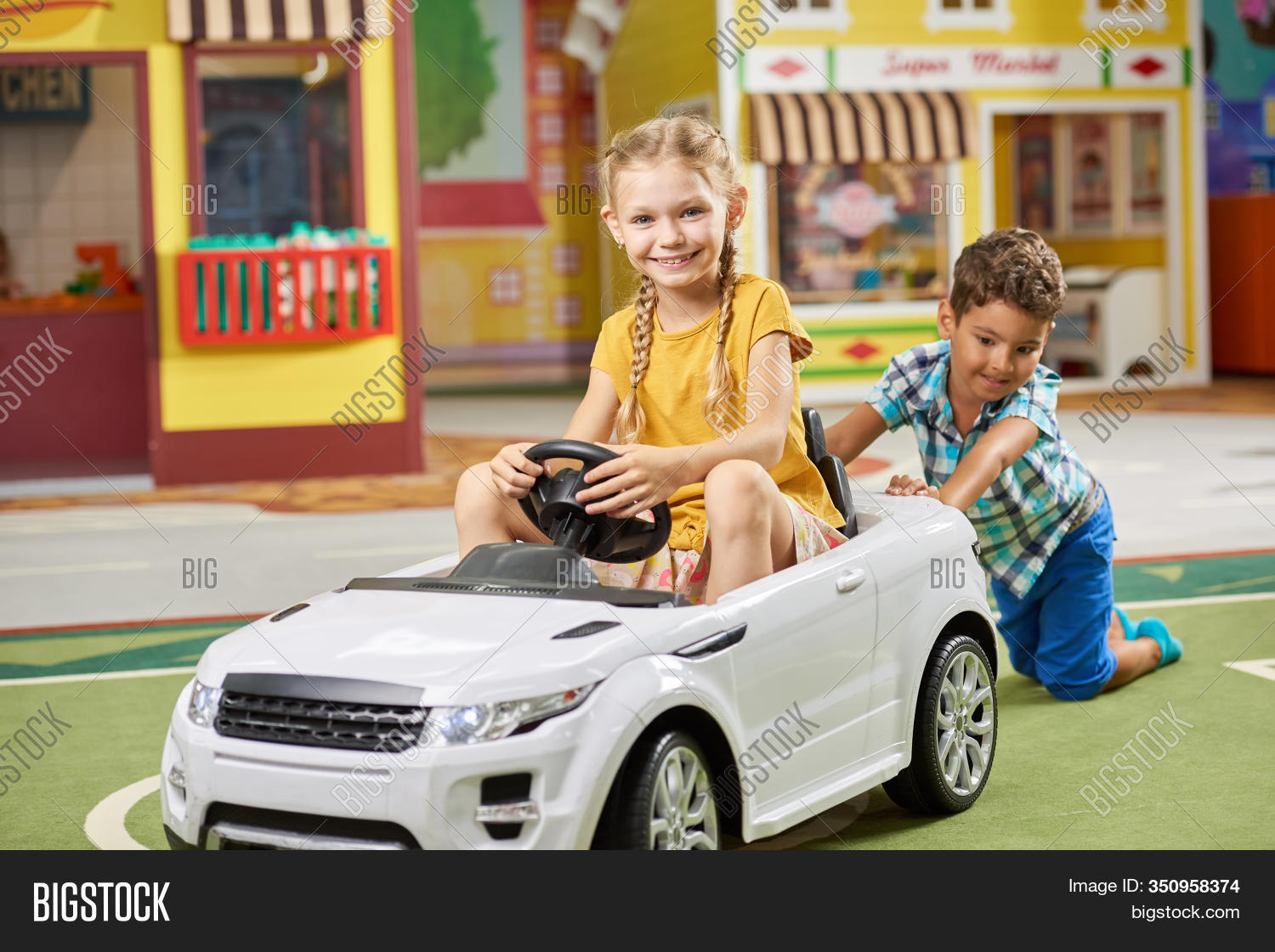 Boy Pushing Little Image & Photo (Free Trial) | Bigstock