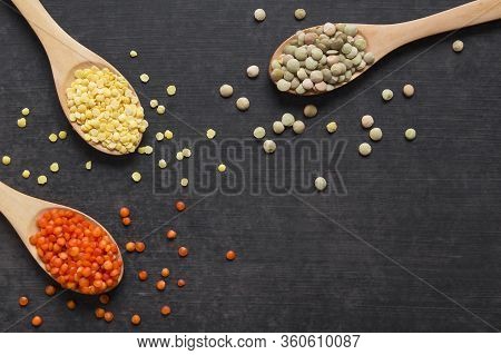 Red, Green And Yellow Lentils In Wooden Spoon On Grey Rustic Background ...