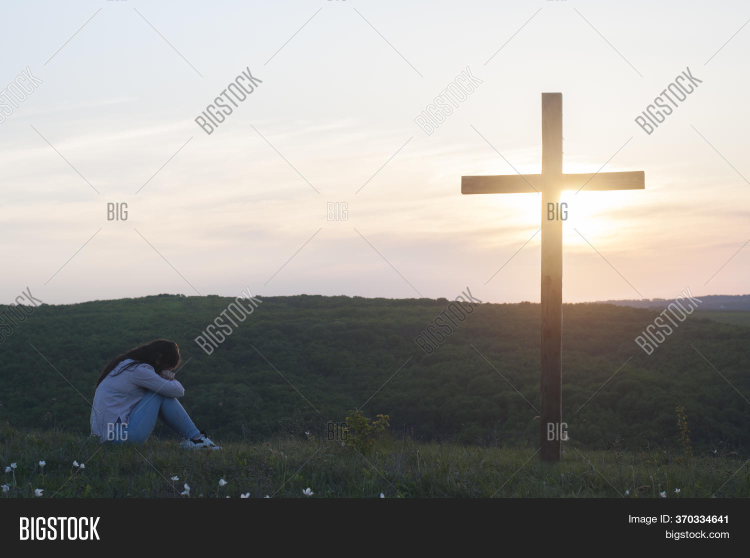Woman Kneeling In Prayer At The Cross