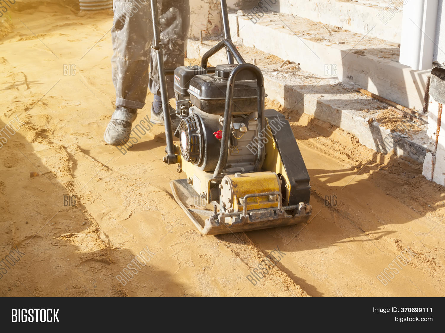 Worker Compresses Sand Image & Photo (Free Trial) | Bigstock