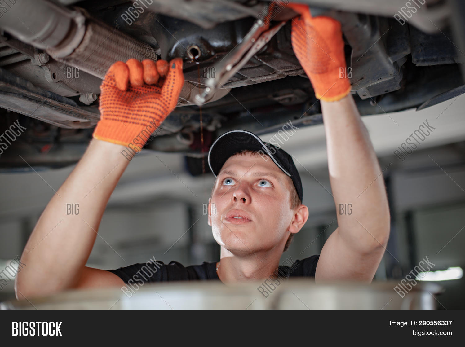 Mechanic Opening Oil Image & Photo (Free Trial) | Bigstock