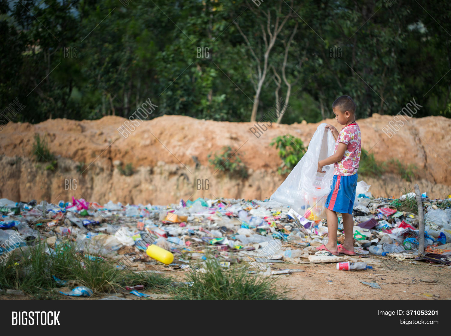 Poor Boy Collecting Image & Photo (Free Trial) | Bigstock