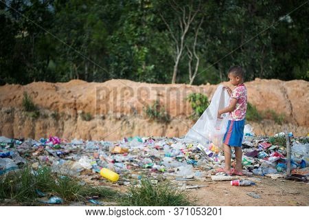 Poor Boy Collecting Image & Photo (Free Trial) | Bigstock