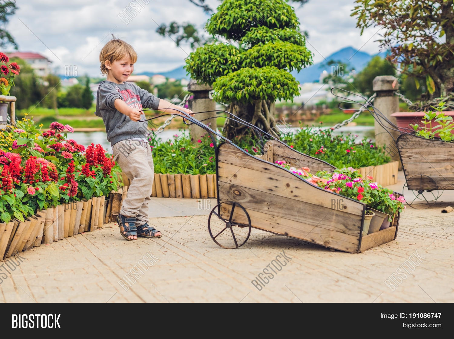 Child Pushing Wheel Image & Photo (Free Trial) | Bigstock