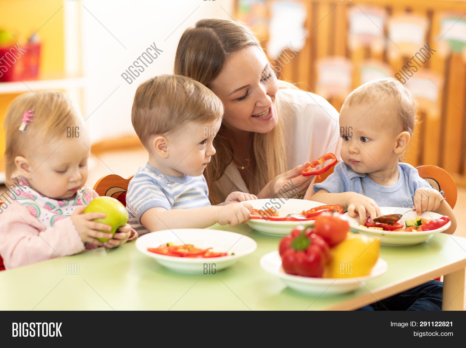 Babysitter Feeding Image & Photo (Free Trial) | Bigstock