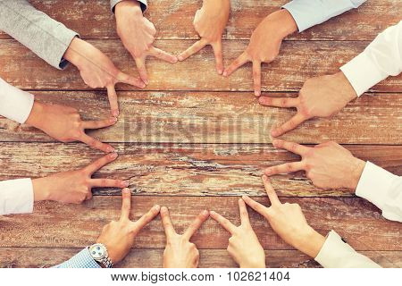 business, people, gesture and team work concept - close up of creative ...