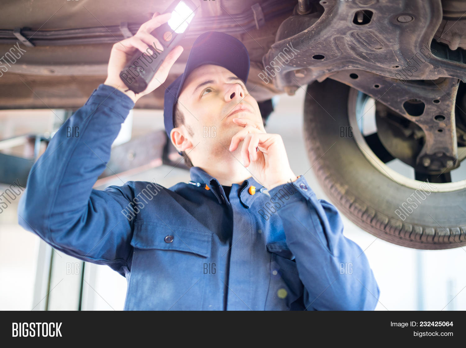 Mechanic Inspecting Image & Photo (Free Trial) | Bigstock