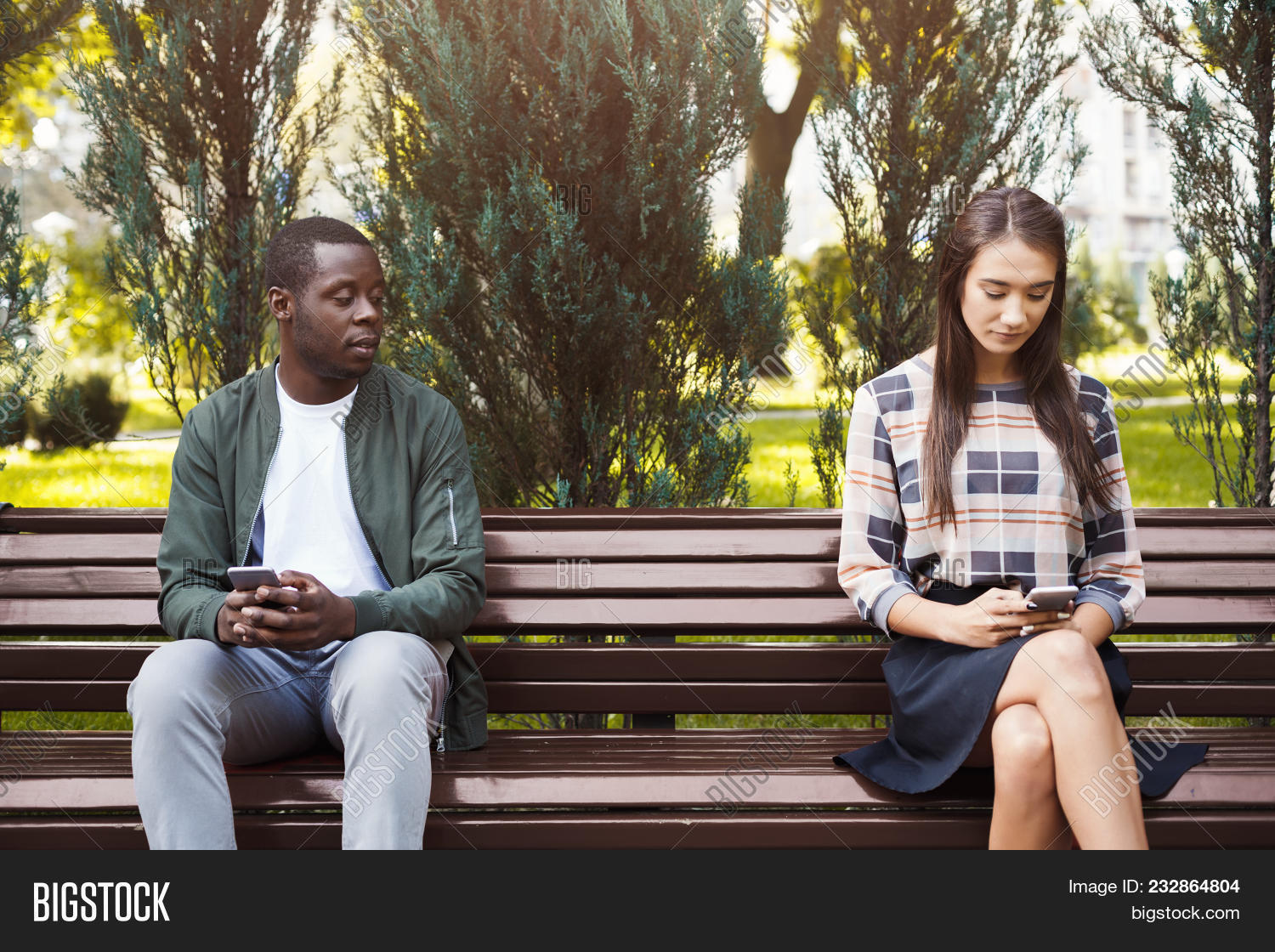 2 People Sitting On A Bench