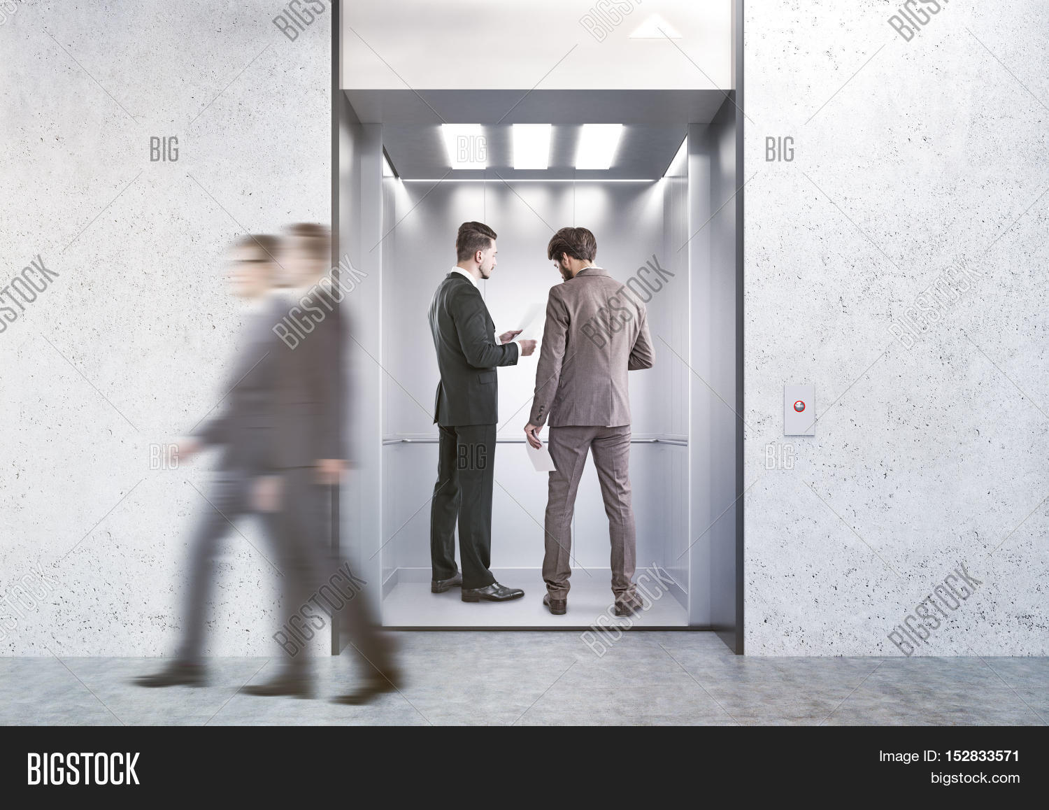 Business People In Elevator