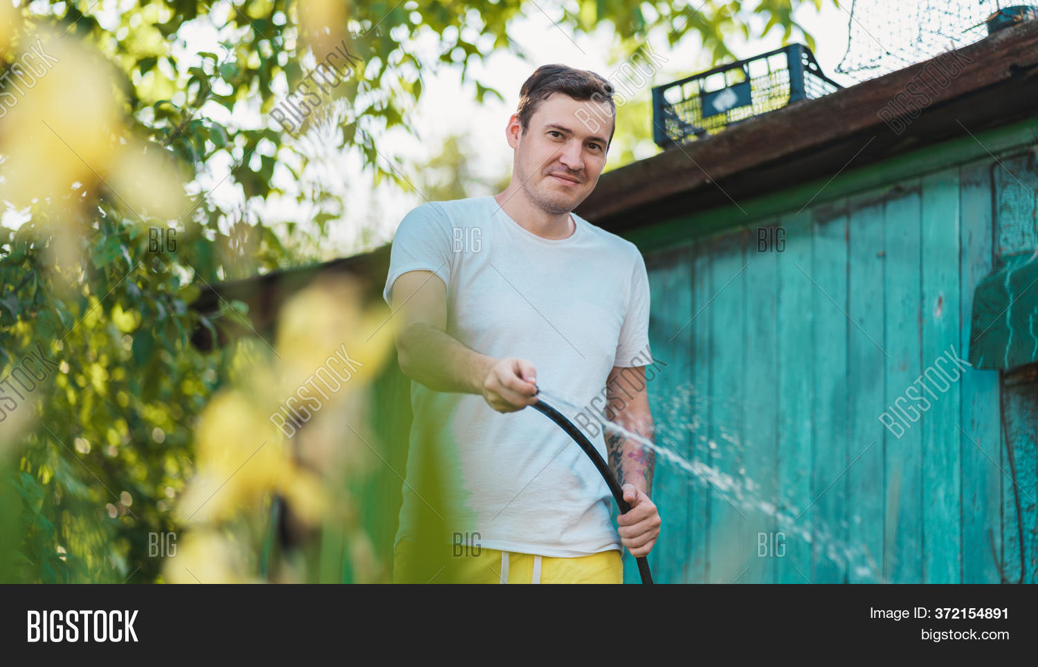 Man Watering Garden Image & Photo (Free Trial) | Bigstock