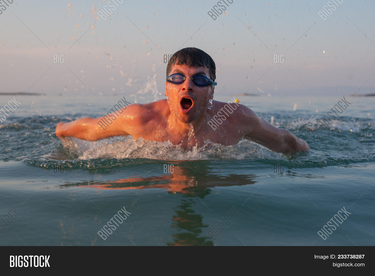 Man Swimming In Ocean