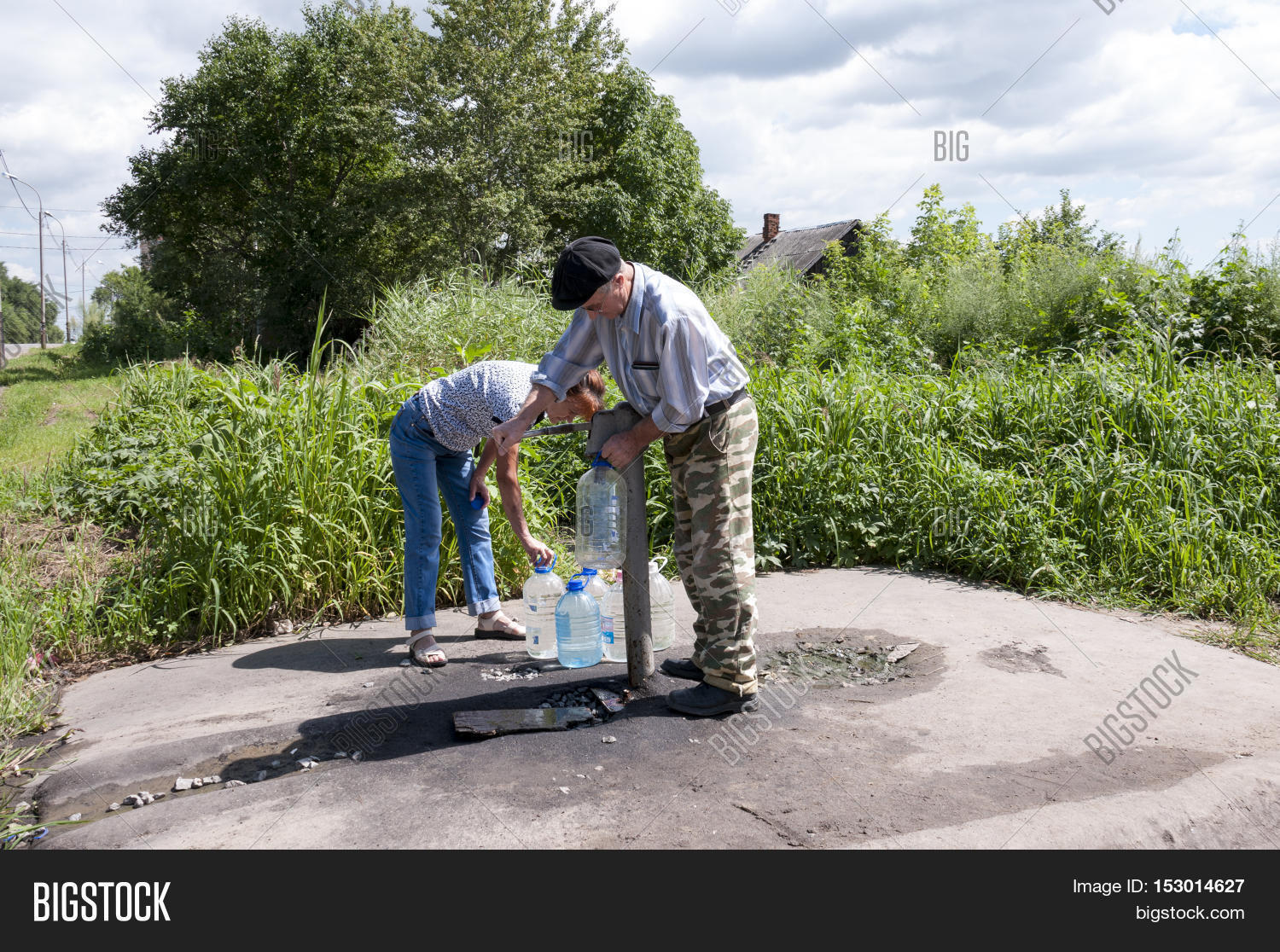 Man Pours Water Into Image & Photo (Free Trial) | Bigstock