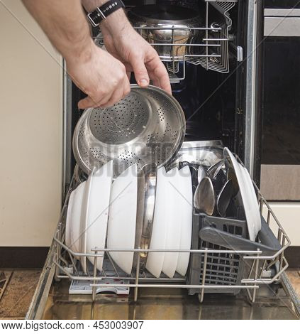 Man Loads Dirty Dishes Image & Photo (Free Trial) | Bigstock
