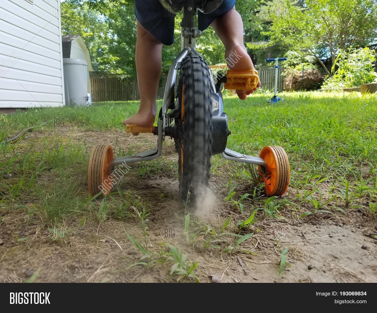 Child Peddling On Bike Image & Photo (Free Trial) | Bigstock