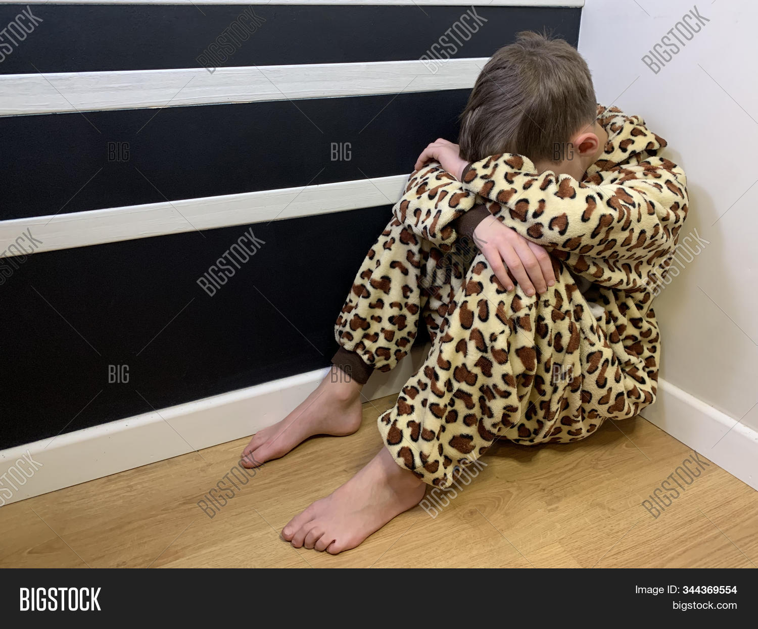 sad guy crying in corner