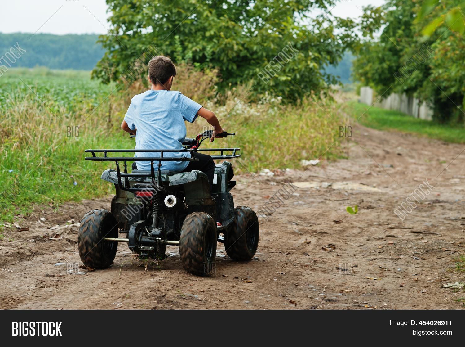 Boy Drive Four-wheller Image & Photo (Free Trial) | Bigstock