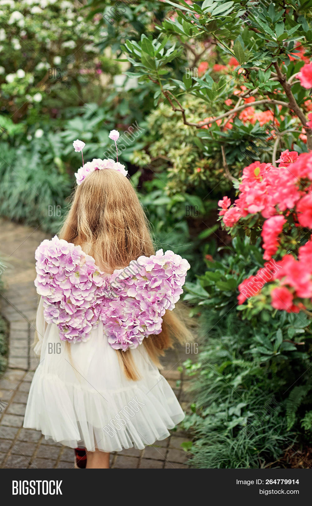 Girl Sniffing Flowers Image & Photo (Free Trial) | Bigstock