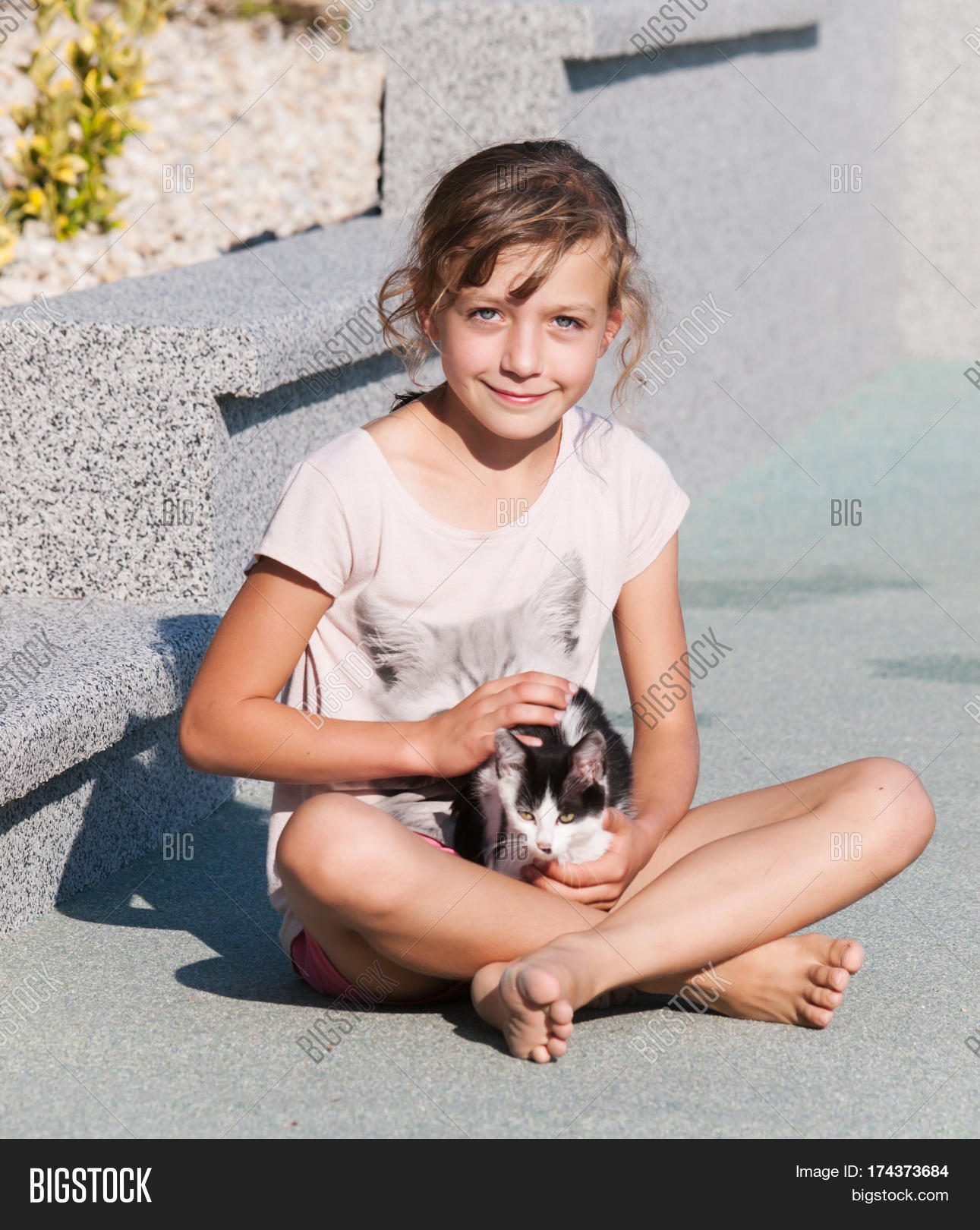 Siting Girl Craddle Image & Photo (Free Trial) | Bigstock