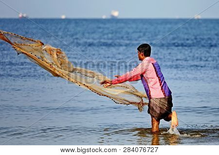 Man Throws Fishing Net Image & Photo (Free Trial) | Bigstock