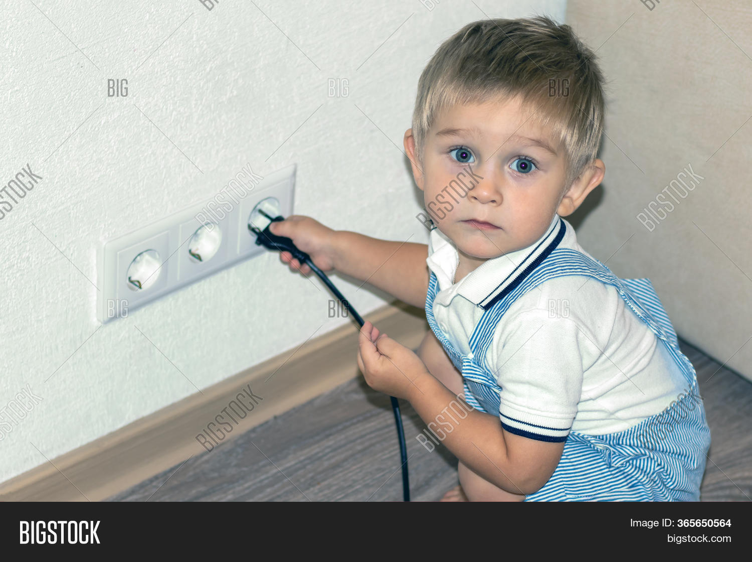 Kid Trying Insert Plug Image & Photo (Free Trial) | Bigstock