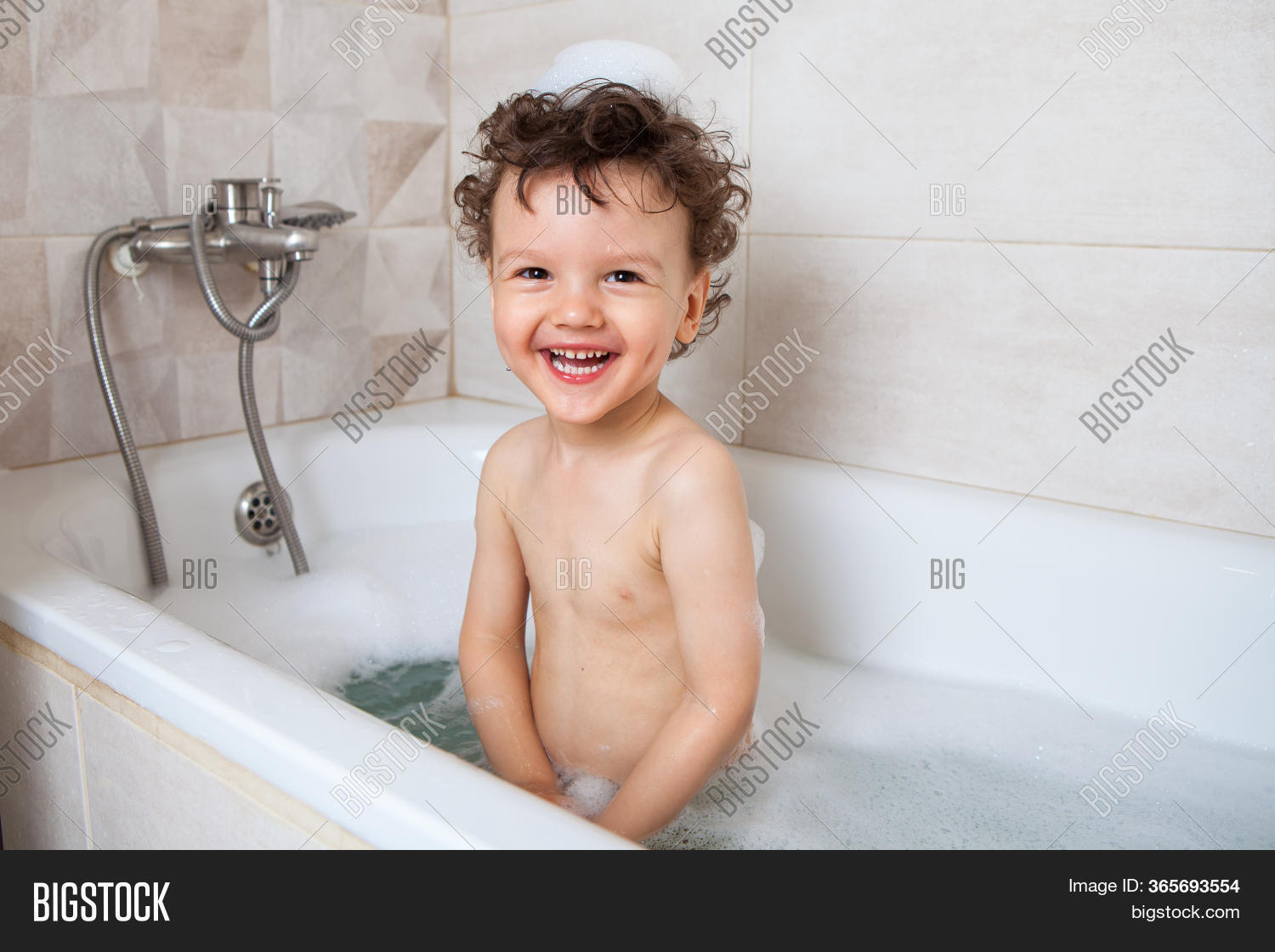 Cute Curly Baby Bathes Image & Photo (Free Trial) | Bigstock