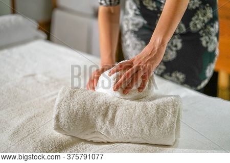 Hands Of Woman Folds A Towel, Prepares A Workplace In The Spa For The ...