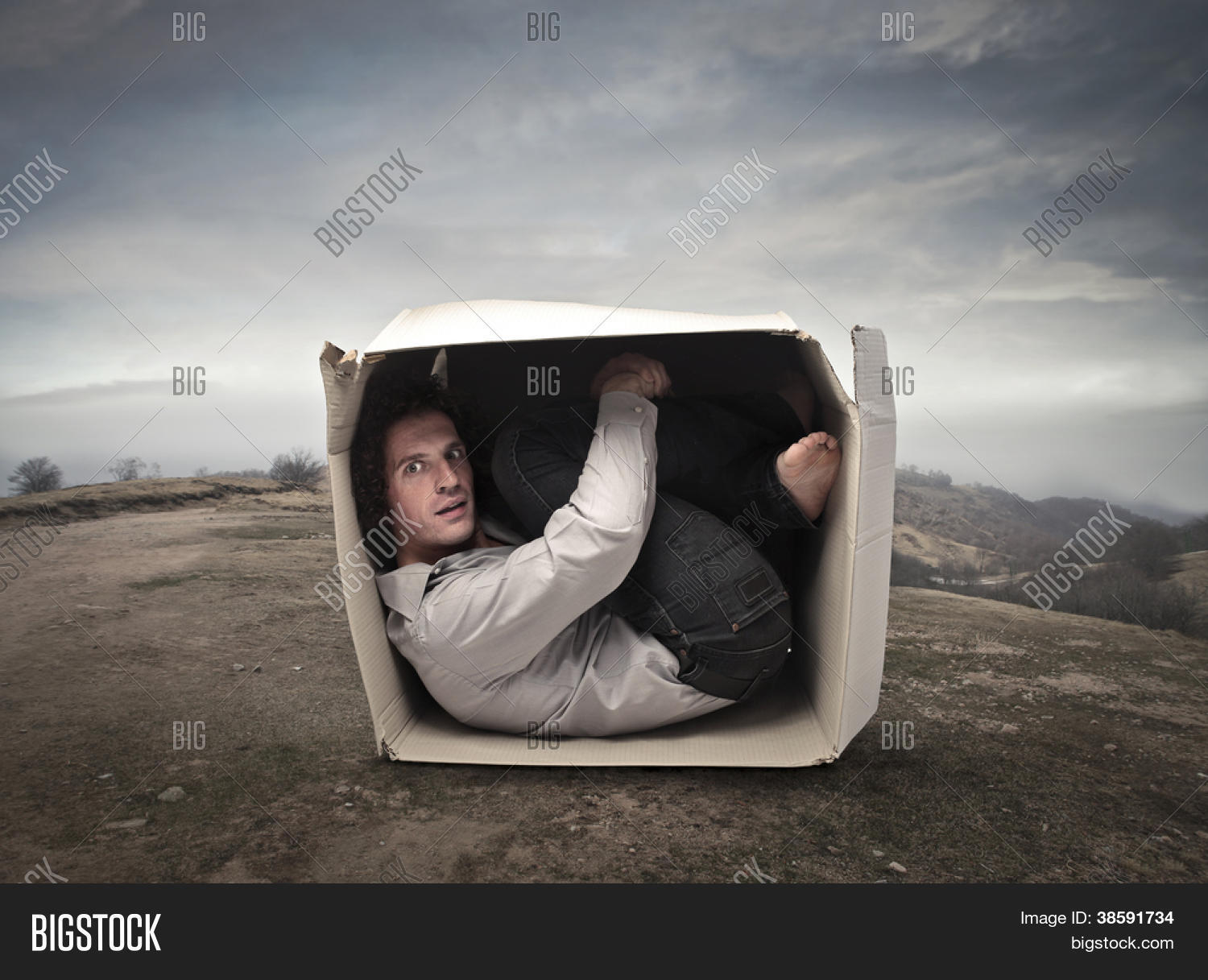 Man Crouched Into Box Image & Photo (Free Trial) | Bigstock