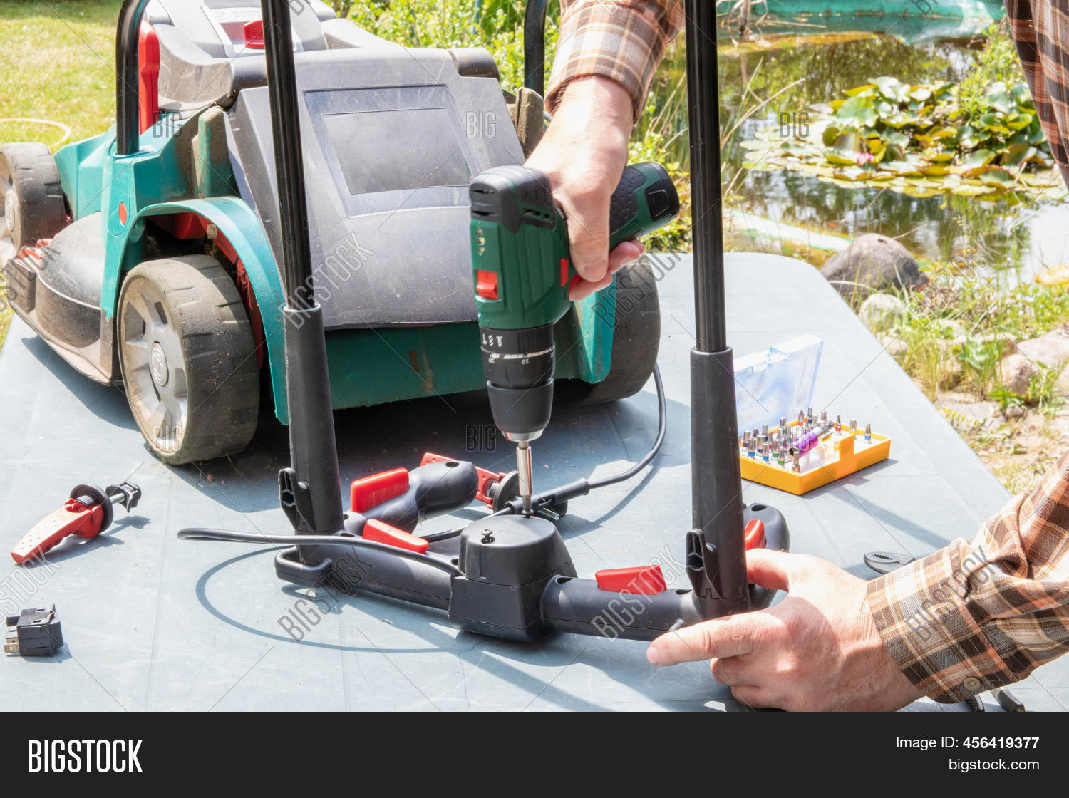 Man Repairing Battery- Image & Photo (Free Trial) | Bigstock