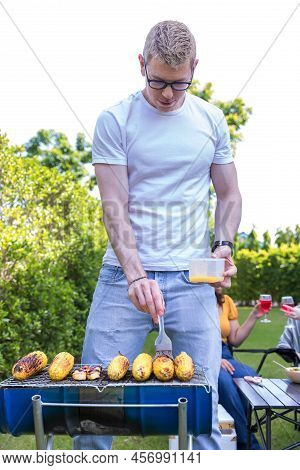 Family Enjoy Backyard Barbecues Party. People Hanging Out At Home Party ...