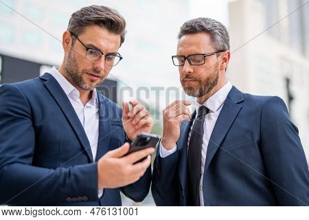 Two People Talking On The Phone