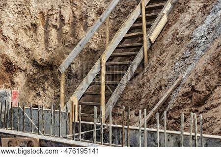 Descent Into A Deep Pit During The Construction Of The Building. Safety ...