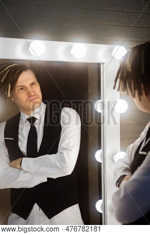 Business Person Looking In Mirror