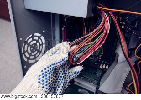 A Repairer Holding A Cable With A Connector Showing A Breakage Of A ...