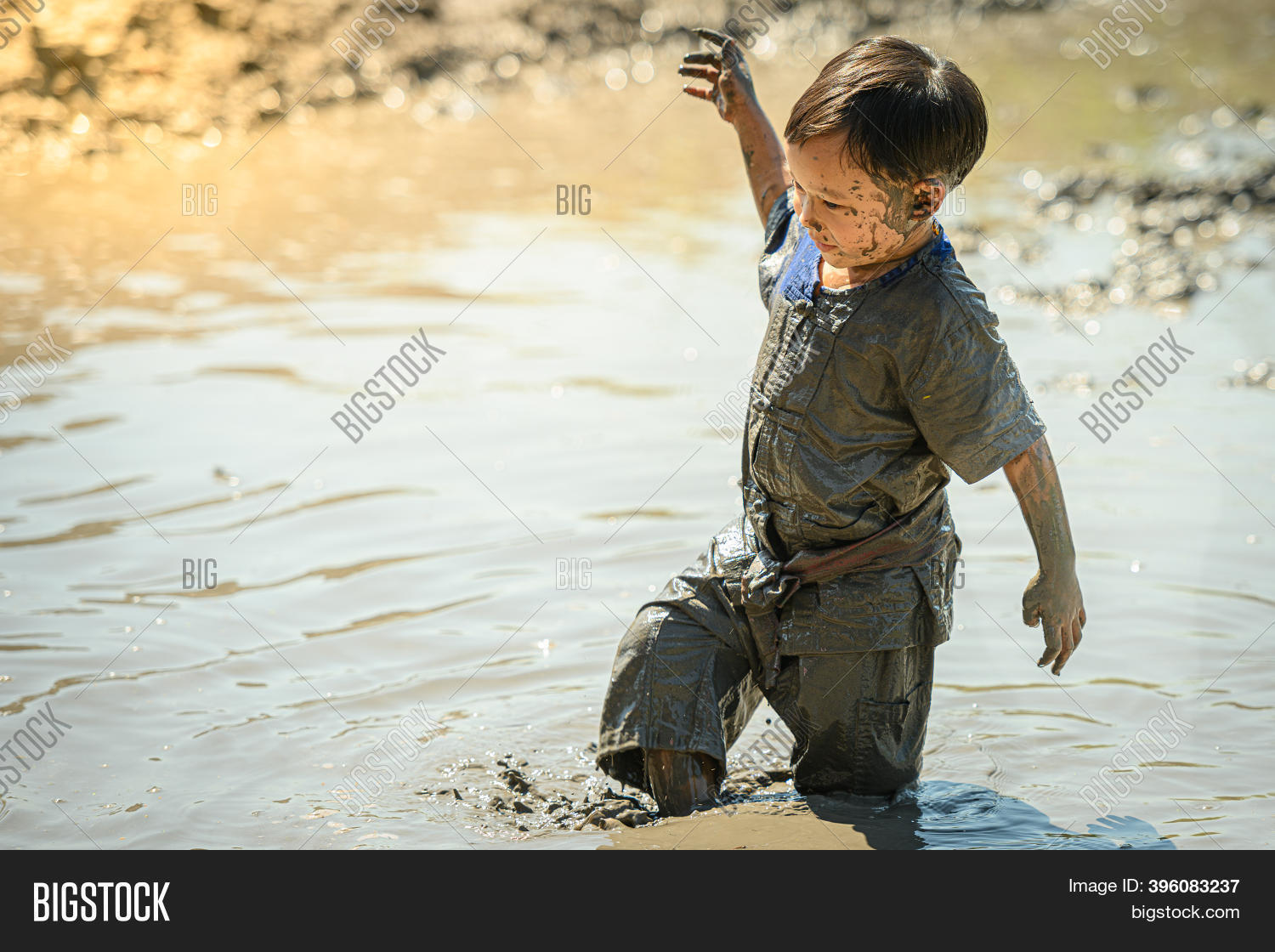 Little Boys Playing In Mud