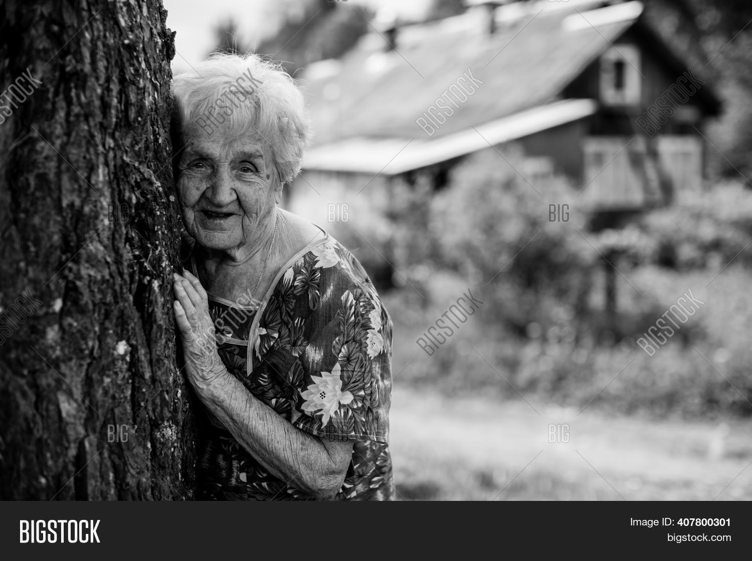Old Woman Hugging Tree Image & Photo (Free Trial) | Bigstock