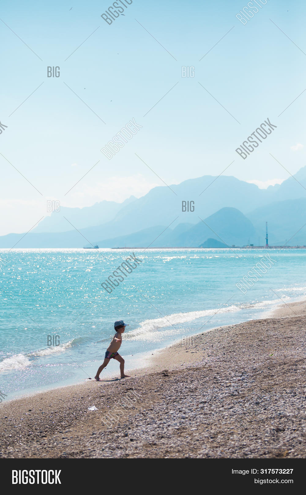 Boy Playing Pebbles On Image & Photo (Free Trial) | Bigstock