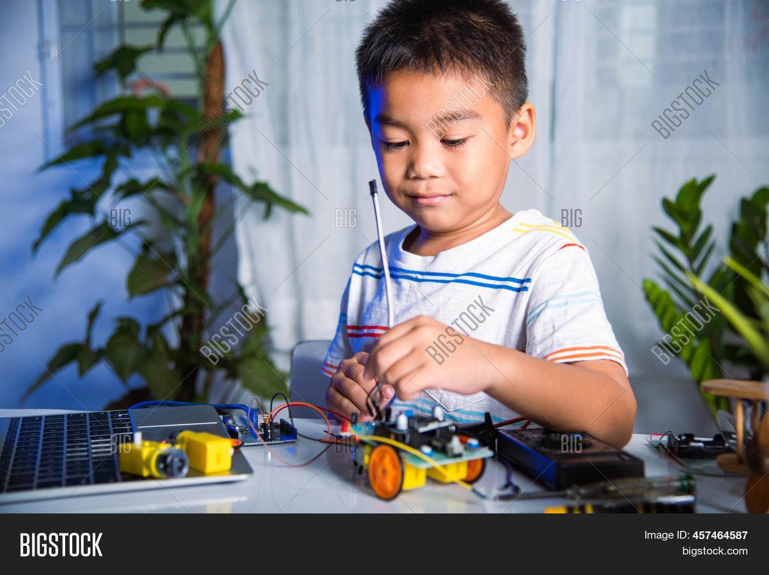 Asian Kid Boy Plugging Image & Photo (Free Trial) | Bigstock