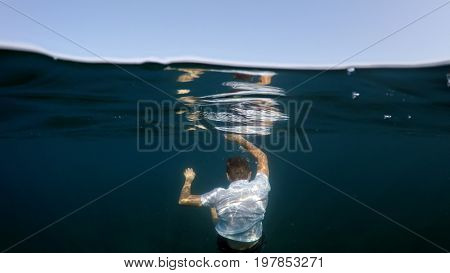 Young Man Sinking Into Image & Photo (Free Trial) | Bigstock