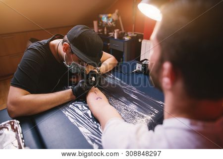 Young Focused Tattoo Image & Photo (Free Trial) | Bigstock