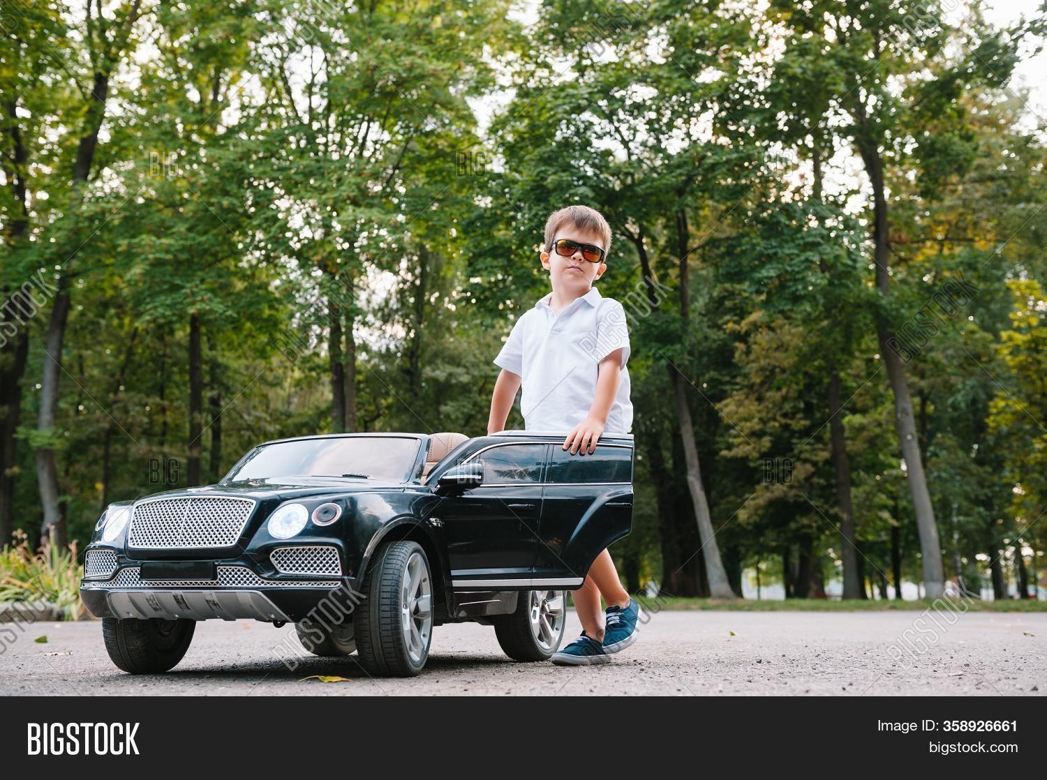 Cute Boy Riding Black Image & Photo (Free Trial) | Bigstock