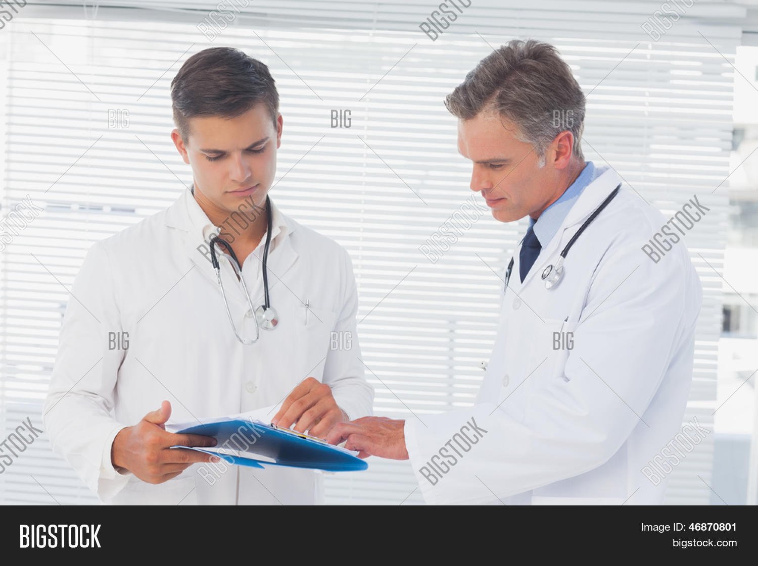 Doctors Reading Folder Image & Photo (Free Trial) | Bigstock
