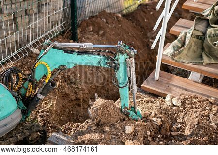 Mini Excavator Digs Image & Photo (Free Trial) | Bigstock