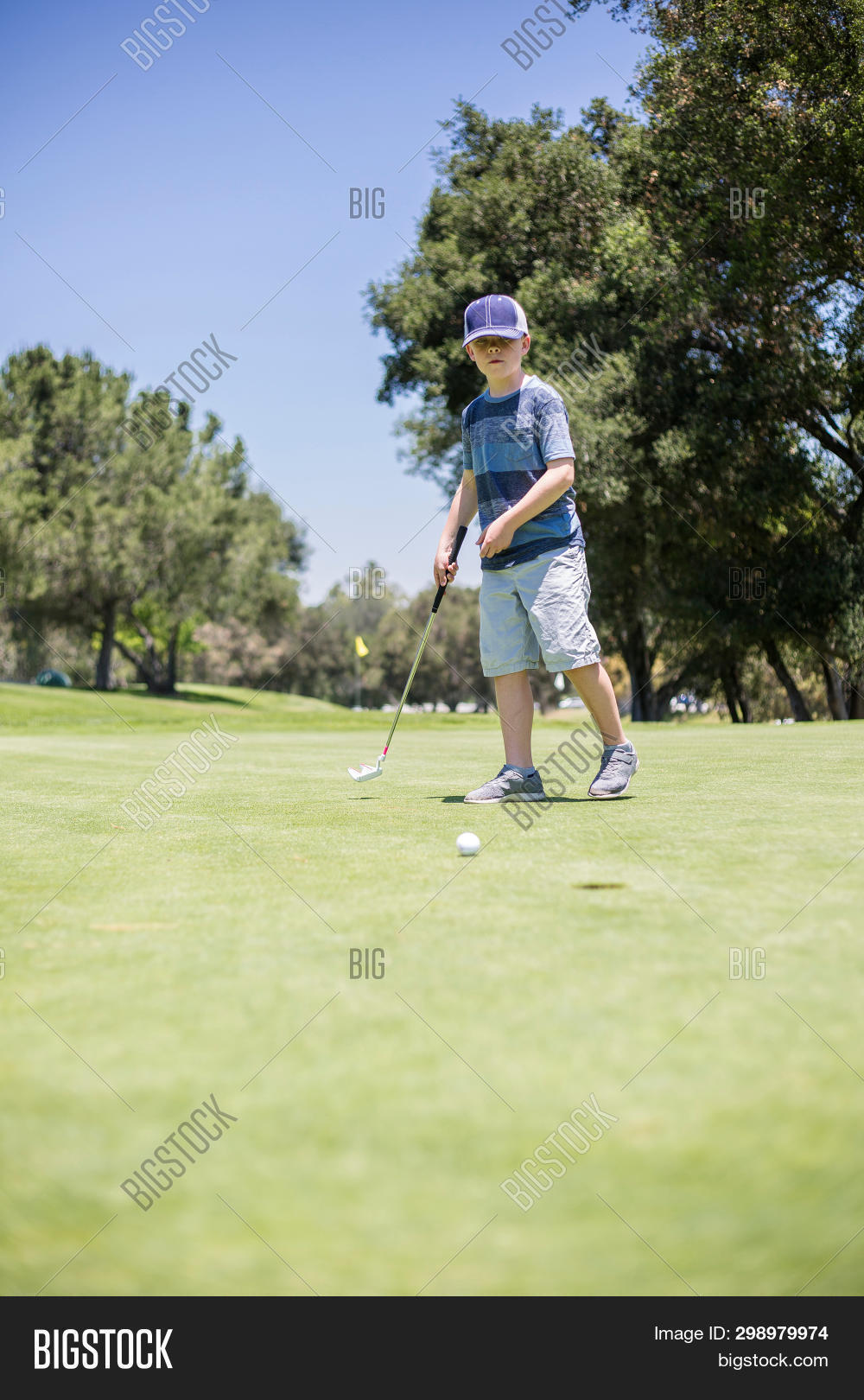 Young Boy Putting Golf Image & Photo (Free Trial) | Bigstock