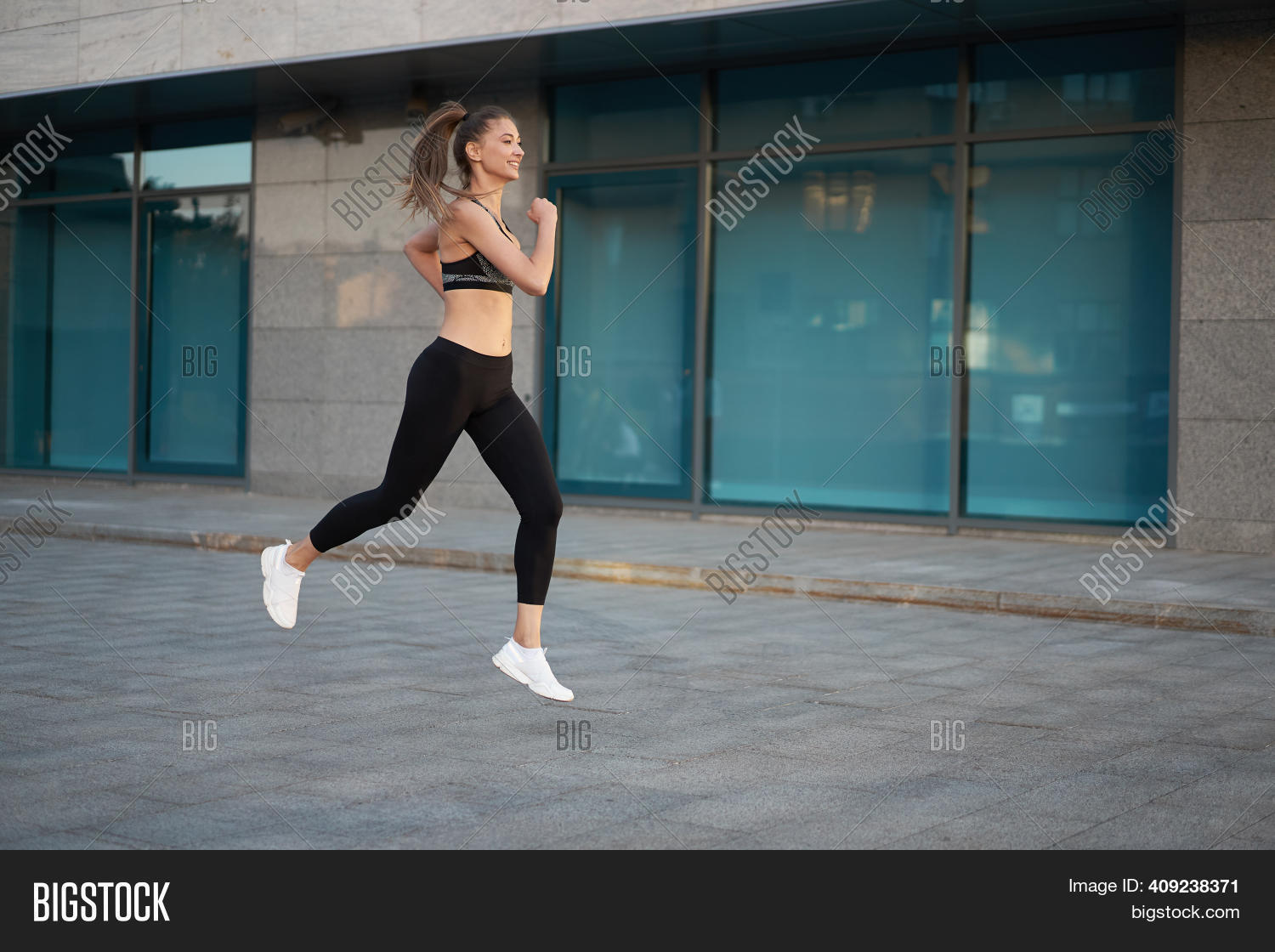Woman Running In City