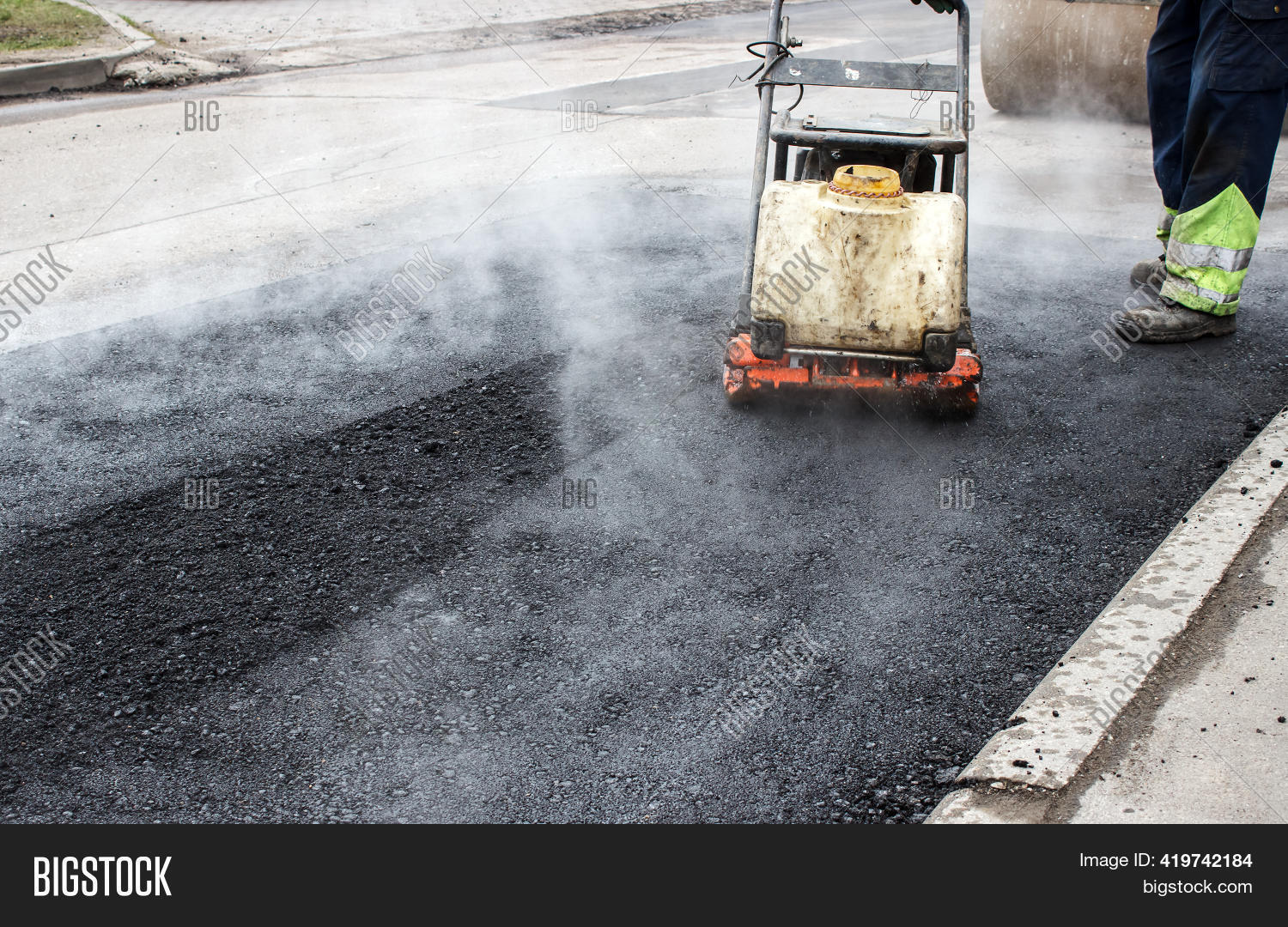 Worker Ramps Asphalt Image & Photo (Free Trial) | Bigstock
