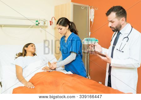 Nurse Adjusting Iv Image & Photo (Free Trial) | Bigstock