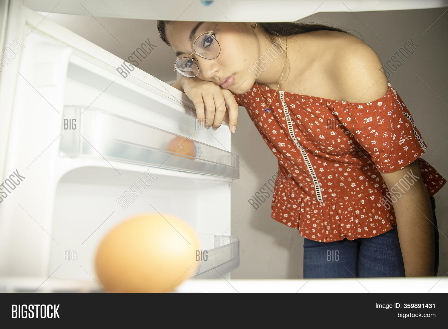 Looking In Empty Refrigerator