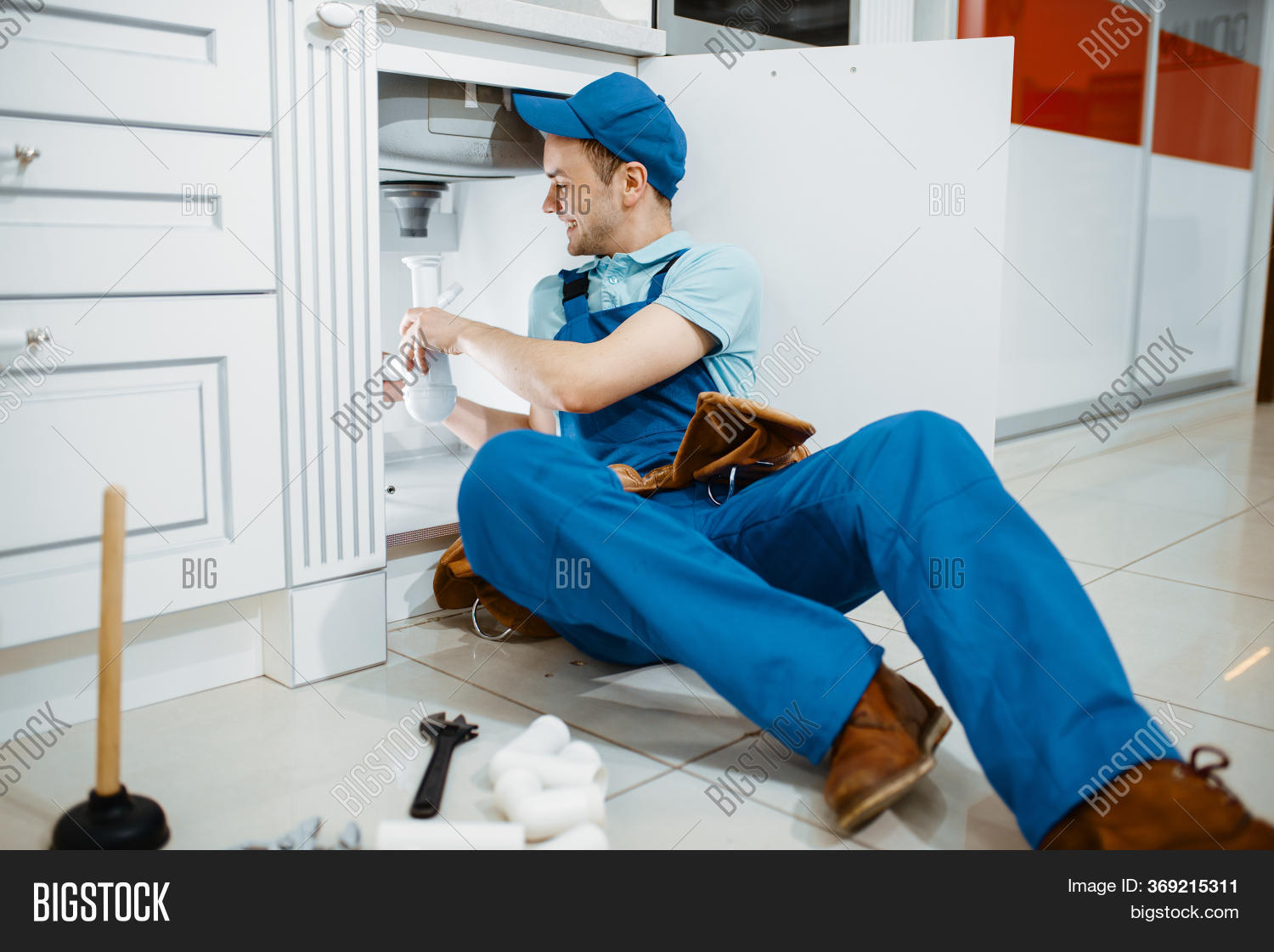 Smiling Male Plumber Image & Photo (Free Trial) | Bigstock