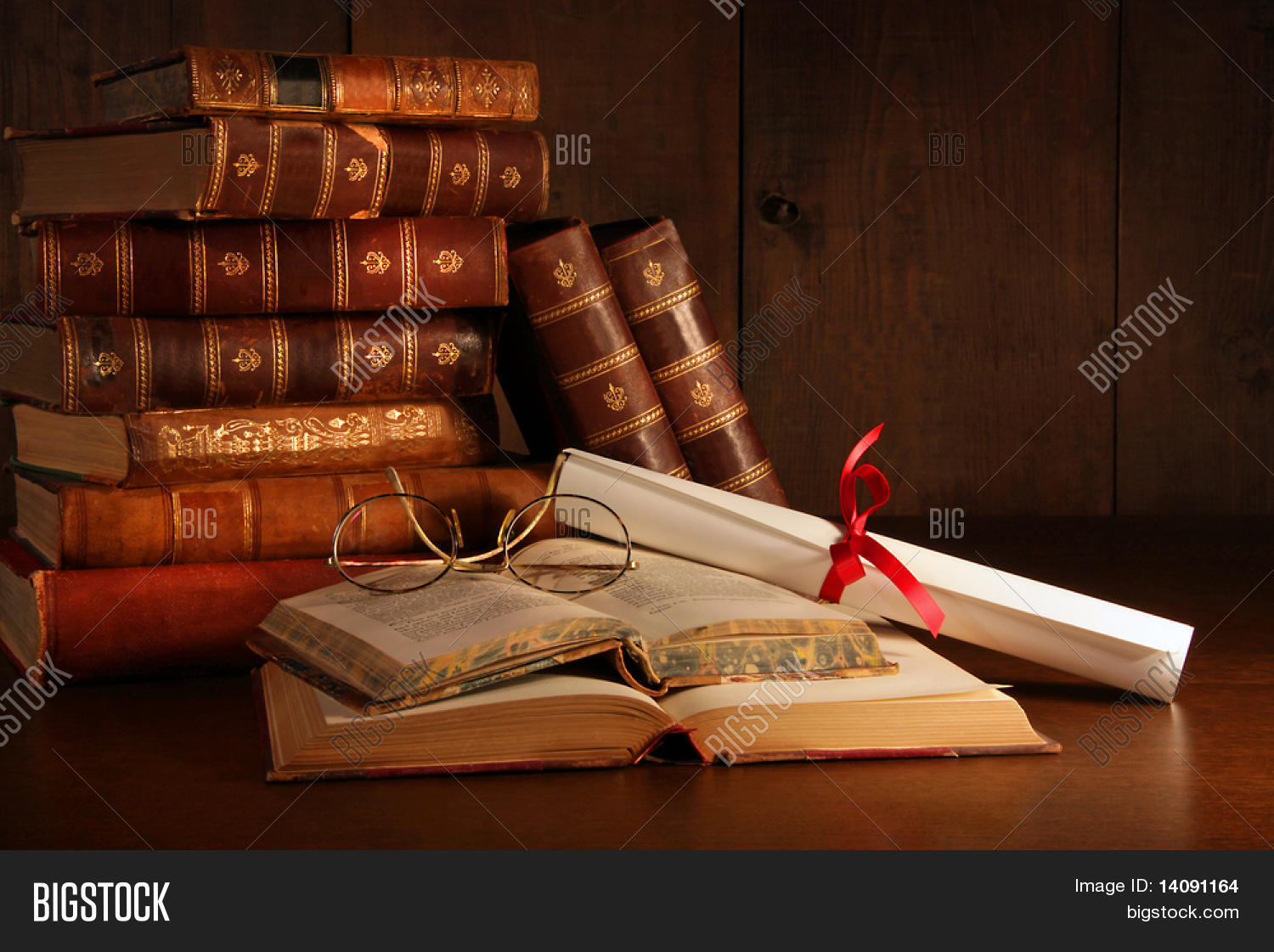 Pile of old books with reading glasses on desk Stock Photo & Stock ...
